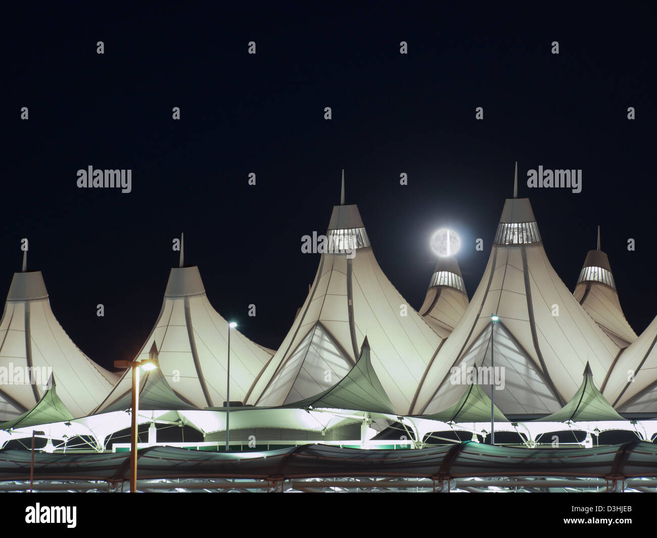 Denver International Airport at dusk with full moon Stock Photo - Alamy