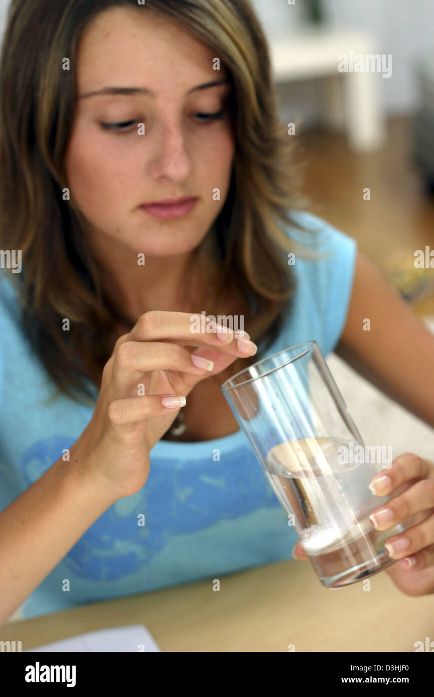 ADOLESCENT TAKING MEDICATION Stock Photo - Alamy