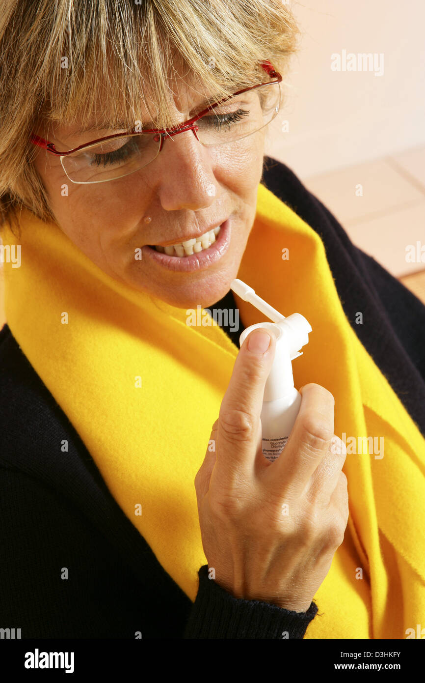 ELDERLY PERSON USING MOUTH SPRAY Stock Photo - Alamy