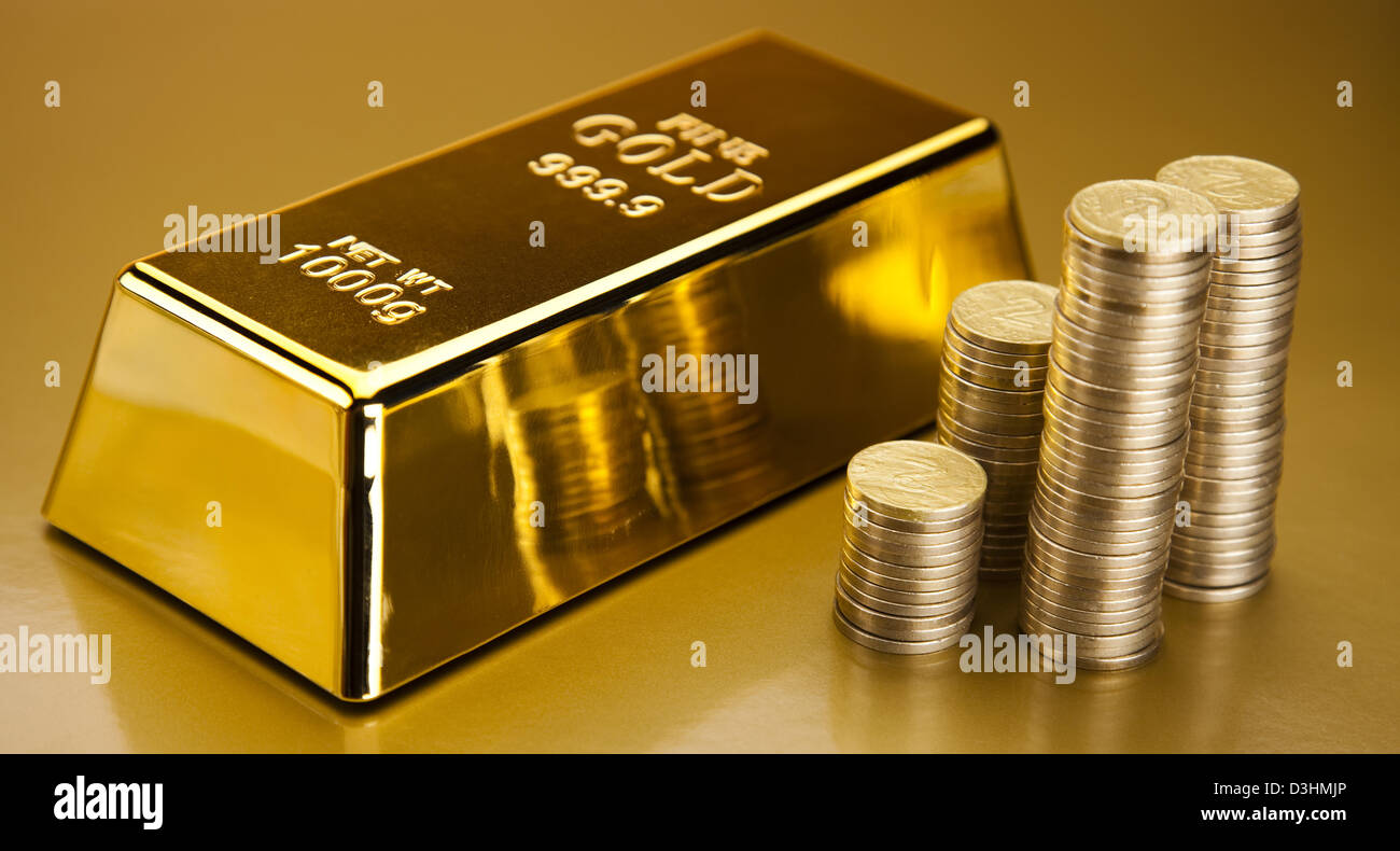 Gold bullion with coins Stock Photo - Alamy