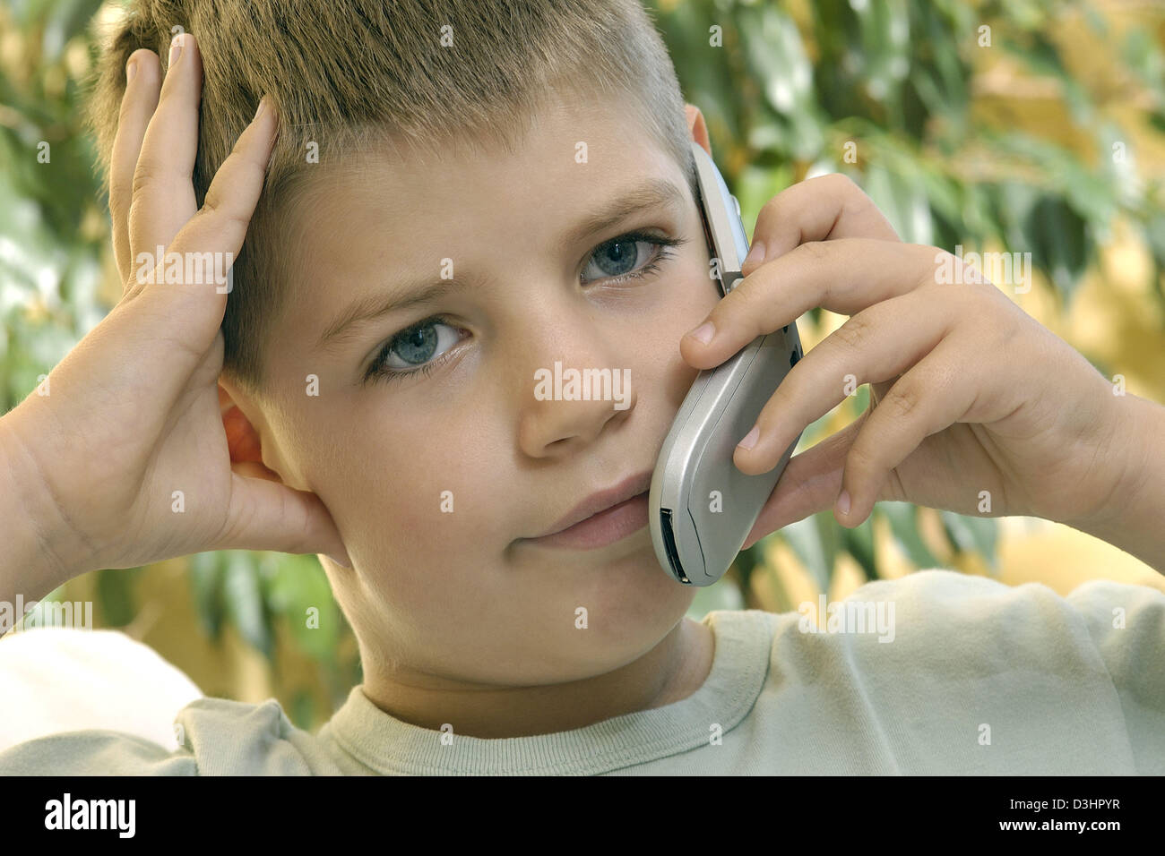 Boy talking cell phone 11 12 years hi-res stock photography and images ...
