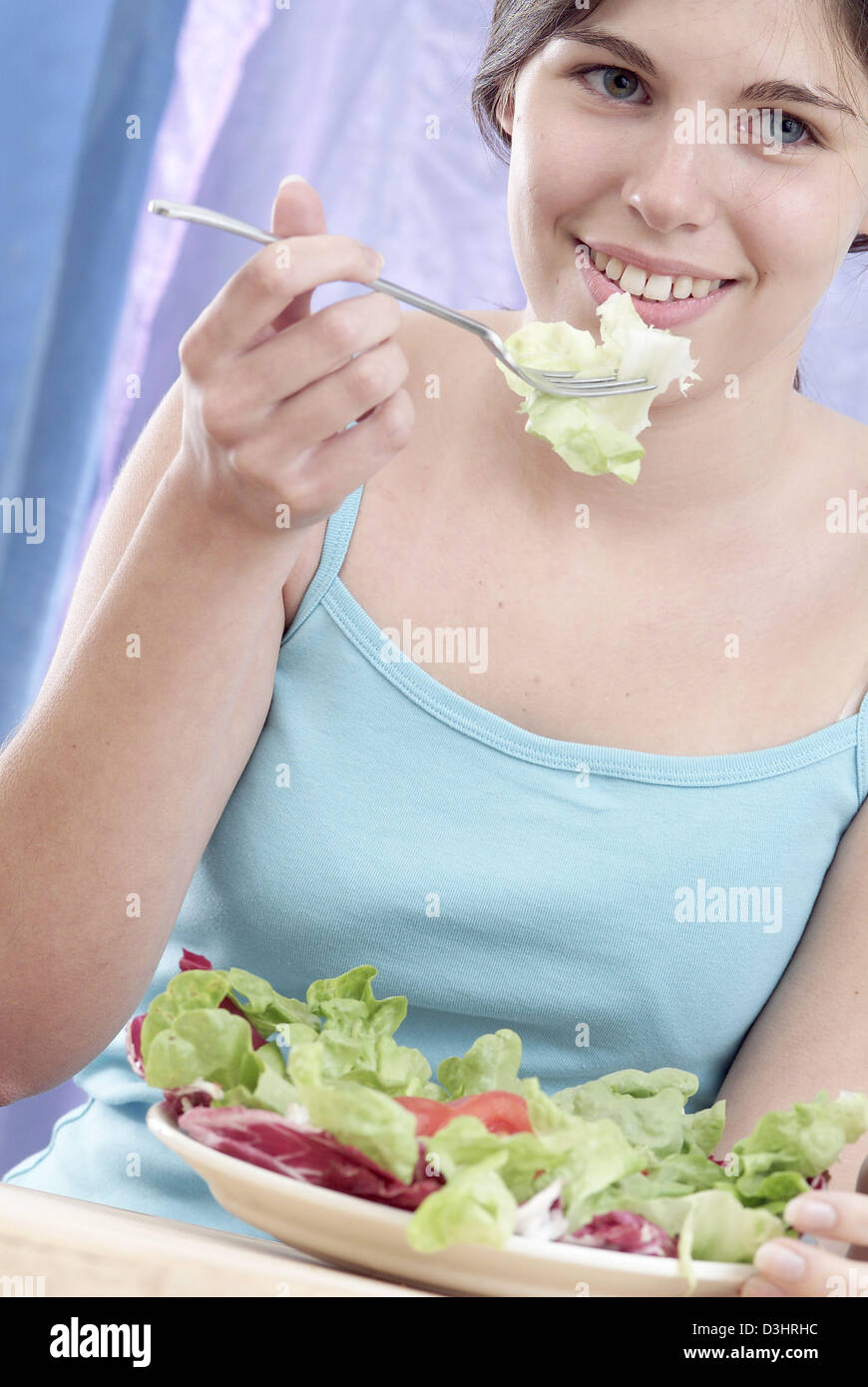 ADOLESCENT EATING SALAD Stock Photo - Alamy