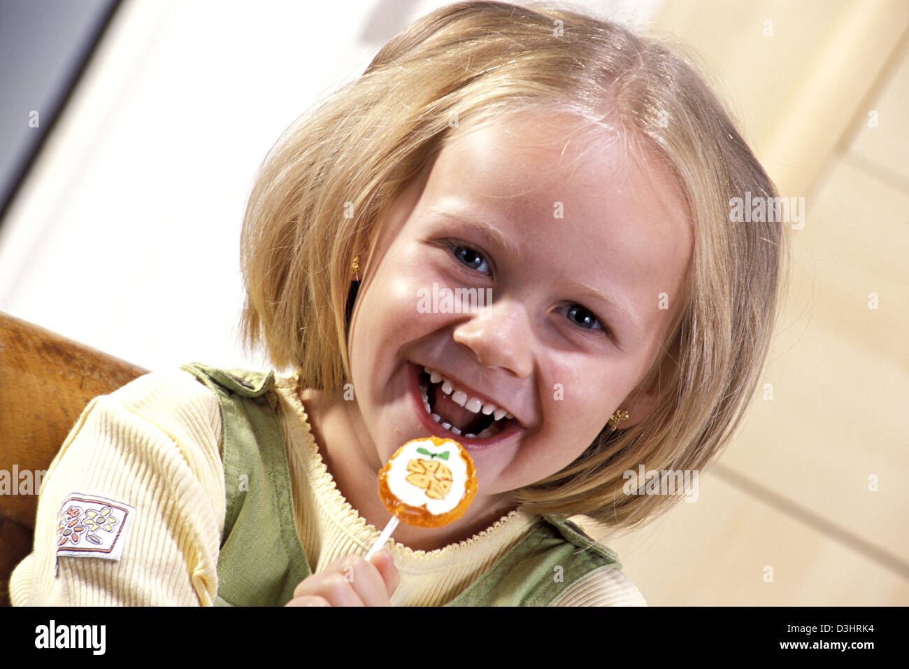 CHILD EATING SWEETS Stock Photo - Alamy