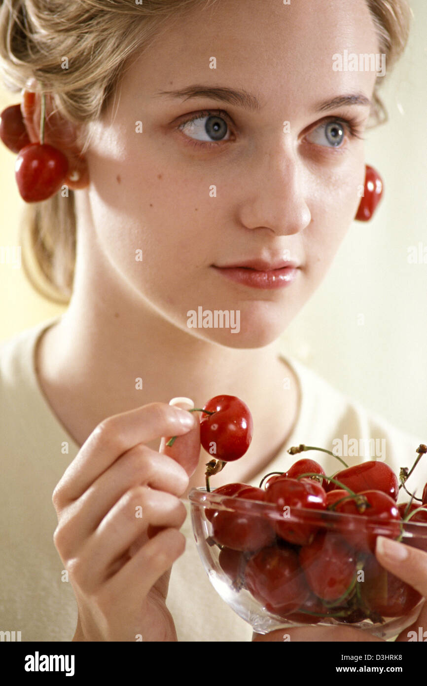WOMAN EATING FRUIT Stock Photo - Alamy