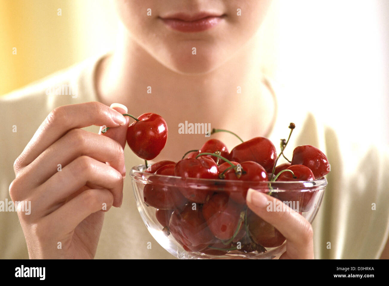 WOMAN EATING FRUIT Stock Photo - Alamy
