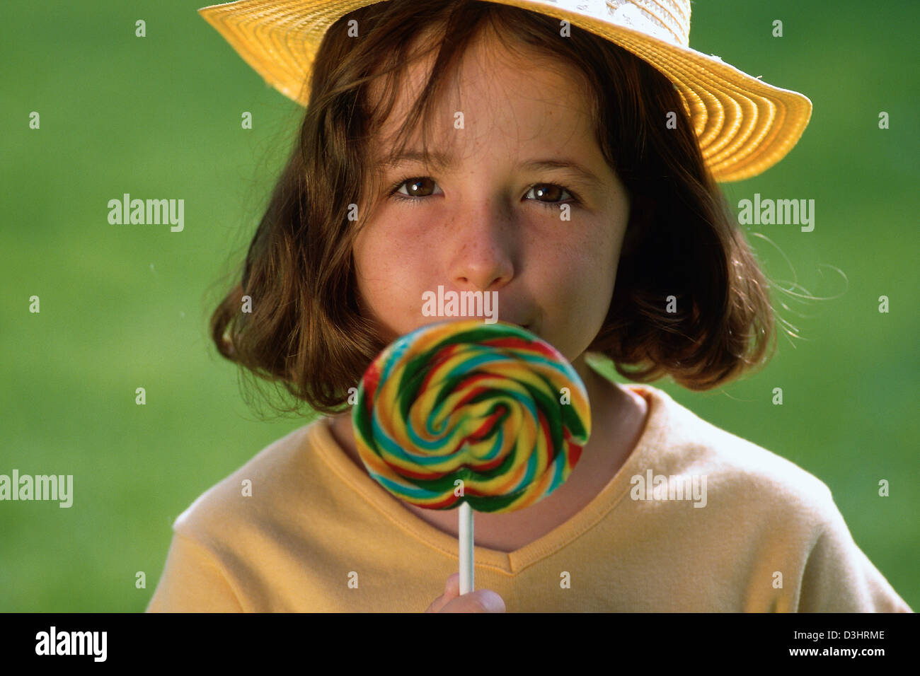 CHILD EATING SWEETS Stock Photo - Alamy