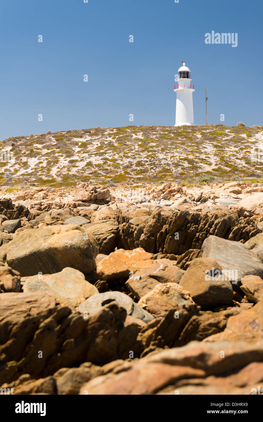 Dangerous rocks surround the lighthouse at Corny Point, South Australia ...