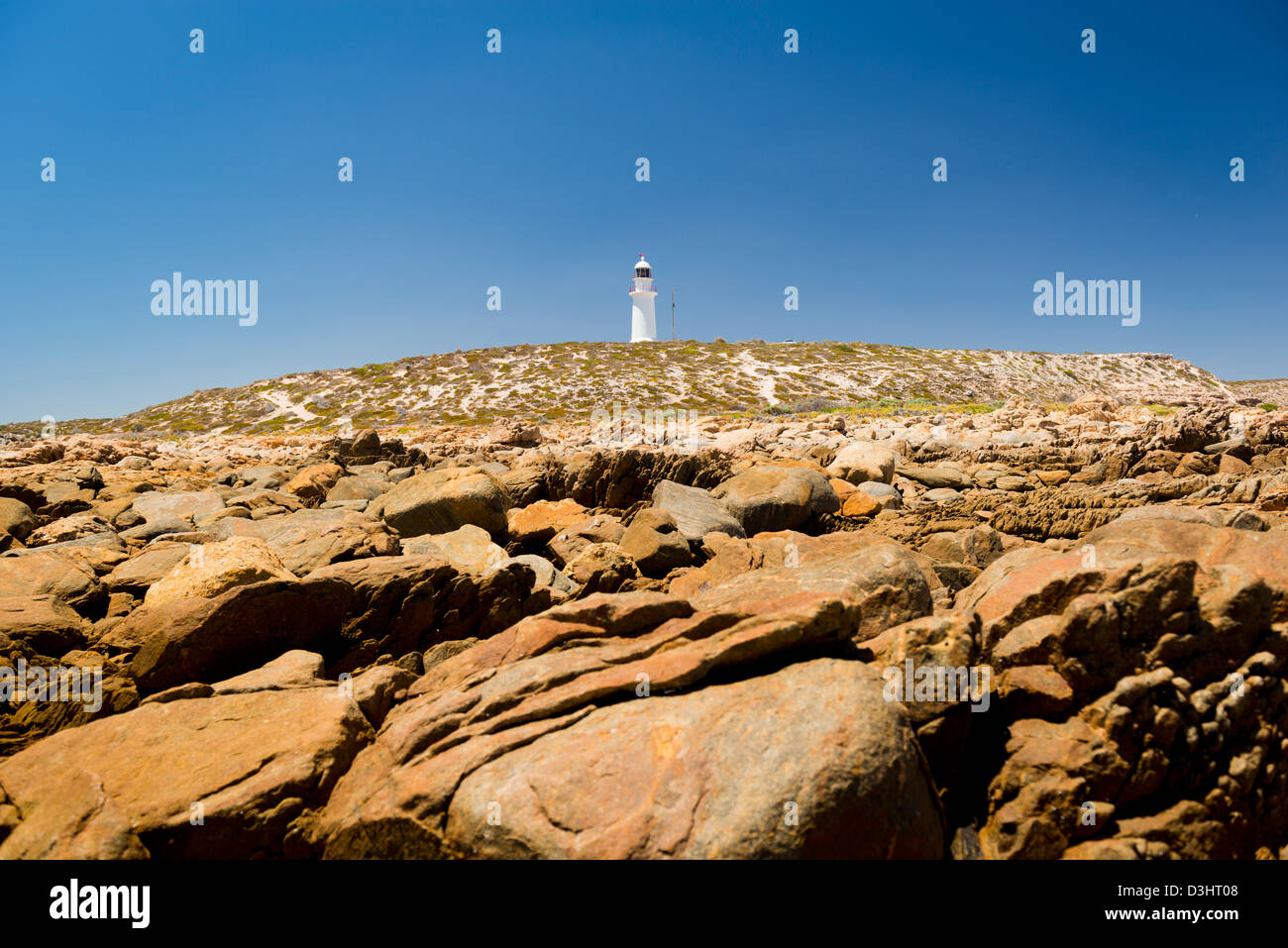 Dangerous rocks surround the lighthouse at Corny Point, South Australia ...