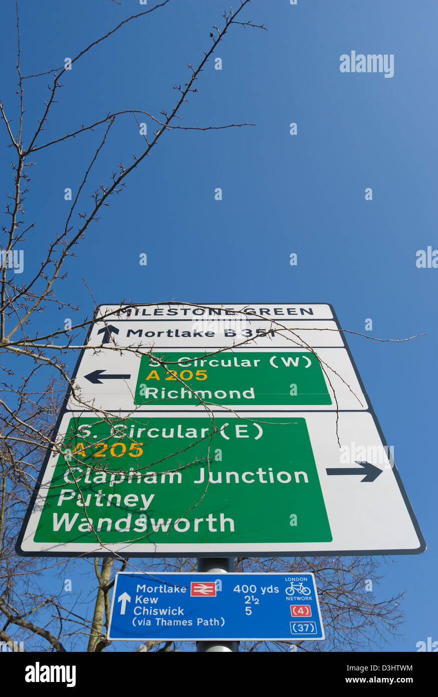 british road sign indicating routes from a junction at milestone green ...