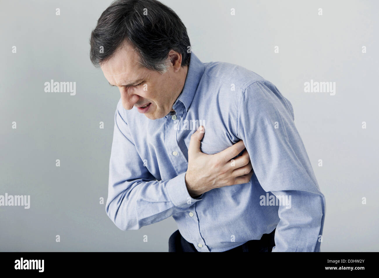 MAN WITH HEART ATTACK Stock Photo - Alamy