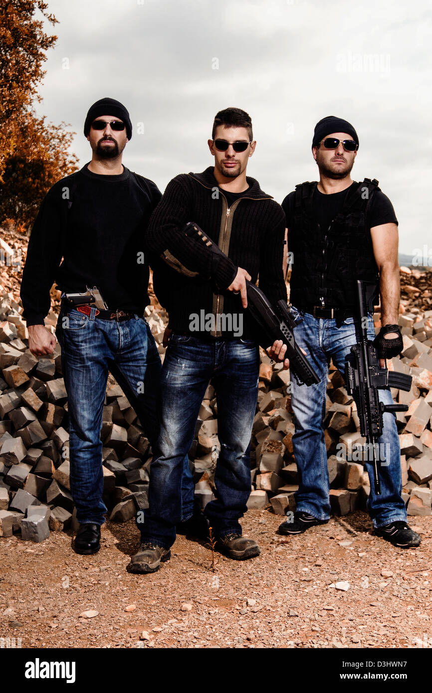 View of a group of gang members with guns Stock Photo - Alamy