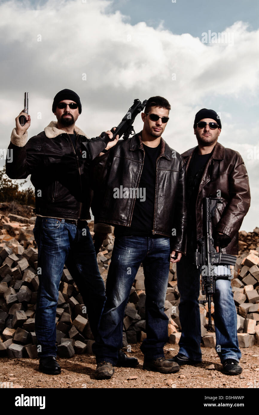 View of a group of gang members with guns Stock Photo - Alamy