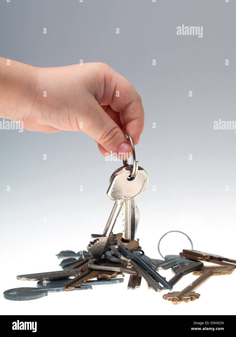 hand child with keys on a white background Stock Photo - Alamy