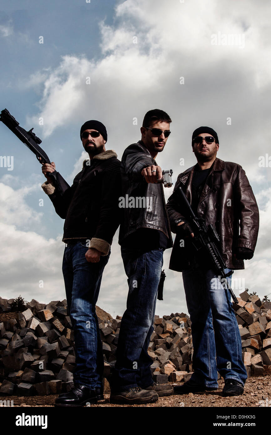 View of a group of gang members with guns Stock Photo - Alamy