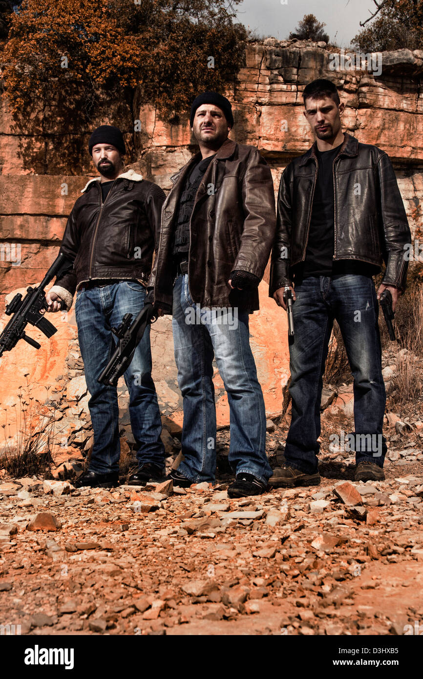 View of a group of gang members with guns Stock Photo - Alamy