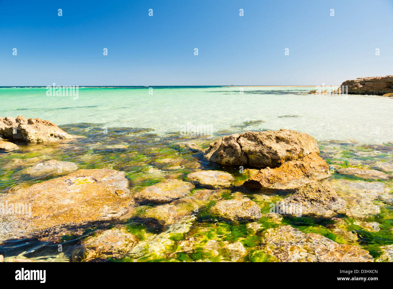 Crystal clear waters with amazing colors along the rocky coast Stock ...
