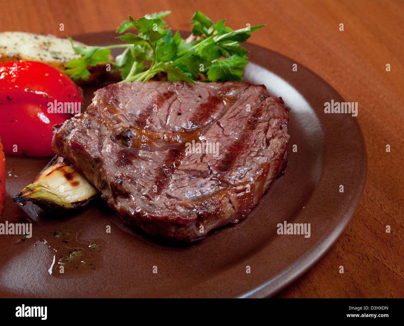 Grilled beef on white plate with vegetable Stock Photo - Alamy