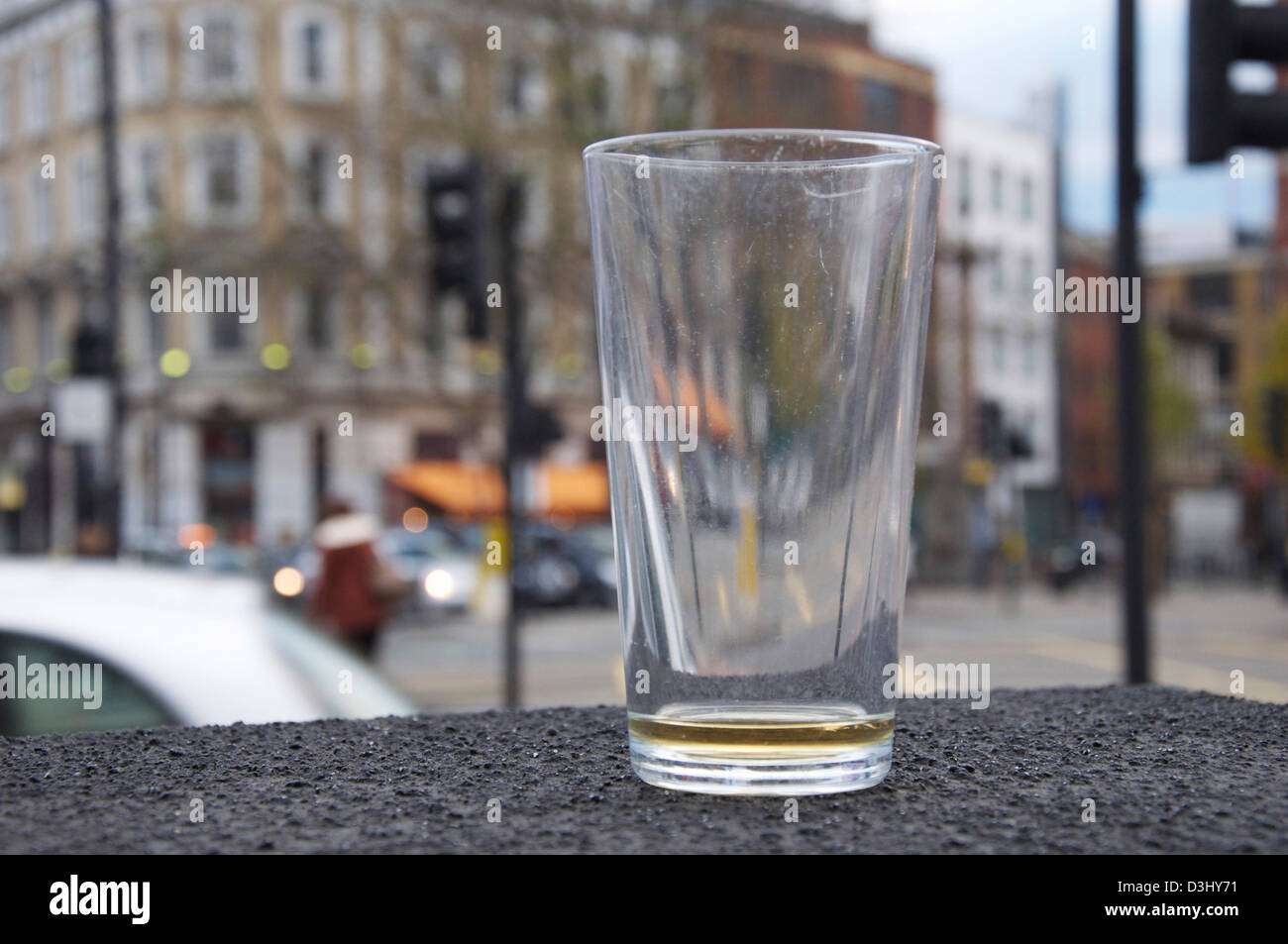 Empty pint glass on Old Street. The morning after the night before ...