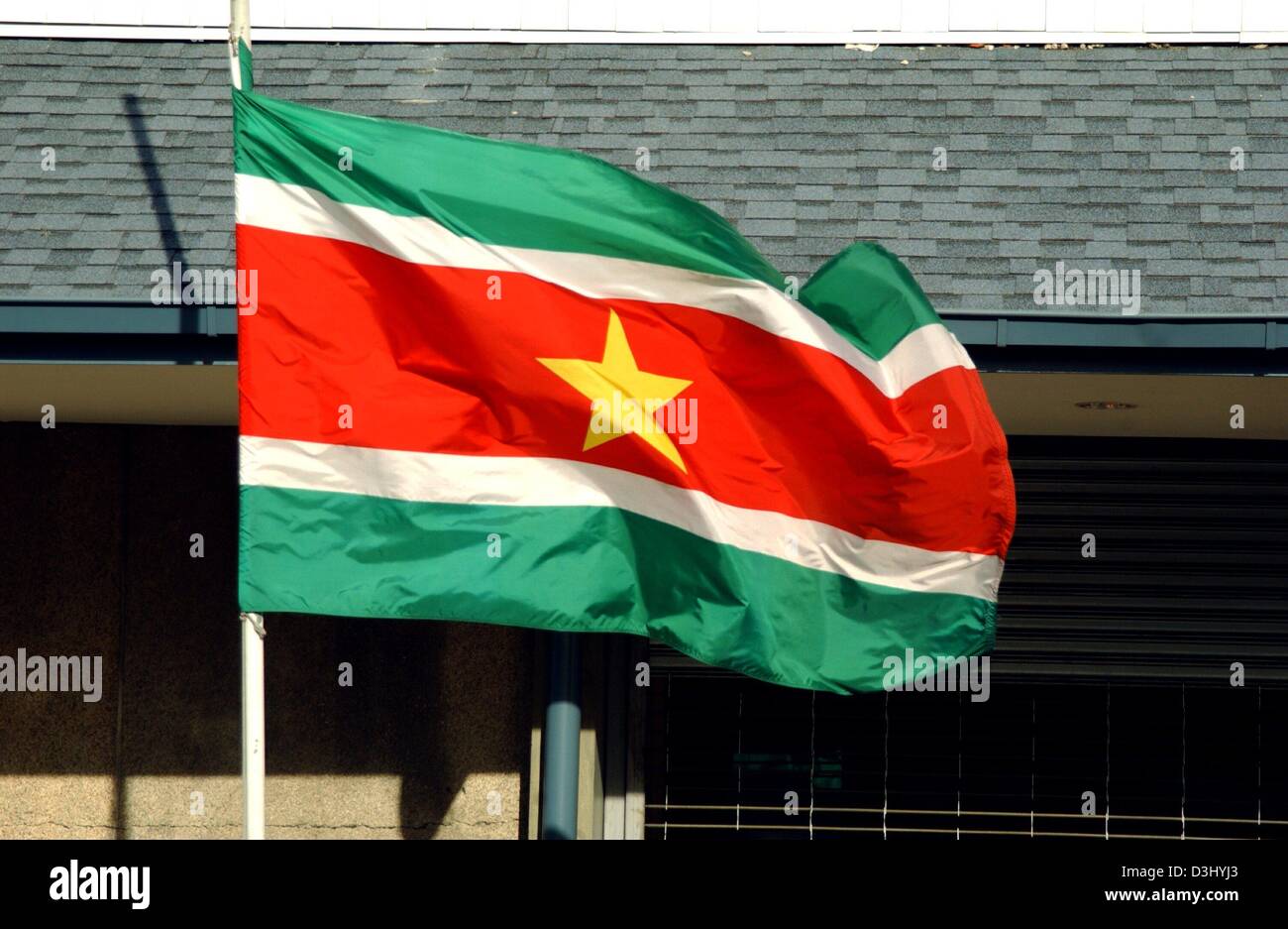 (dpa) - The national flag of Surinam flutters in the wind in Paramaribo ...