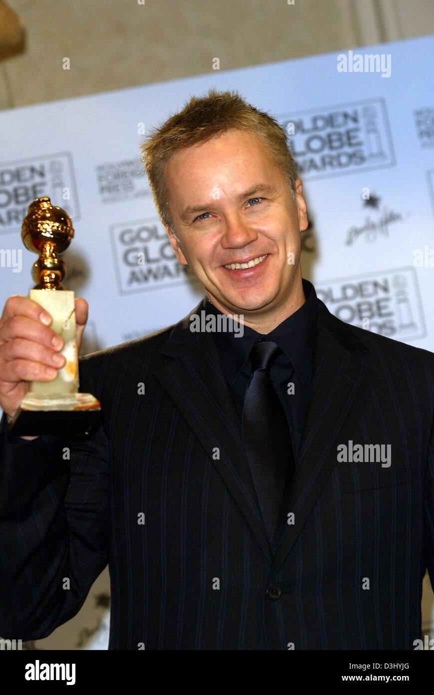 (dpa) - US actor Tim Robbins smiles as he poses with his trophy after ...