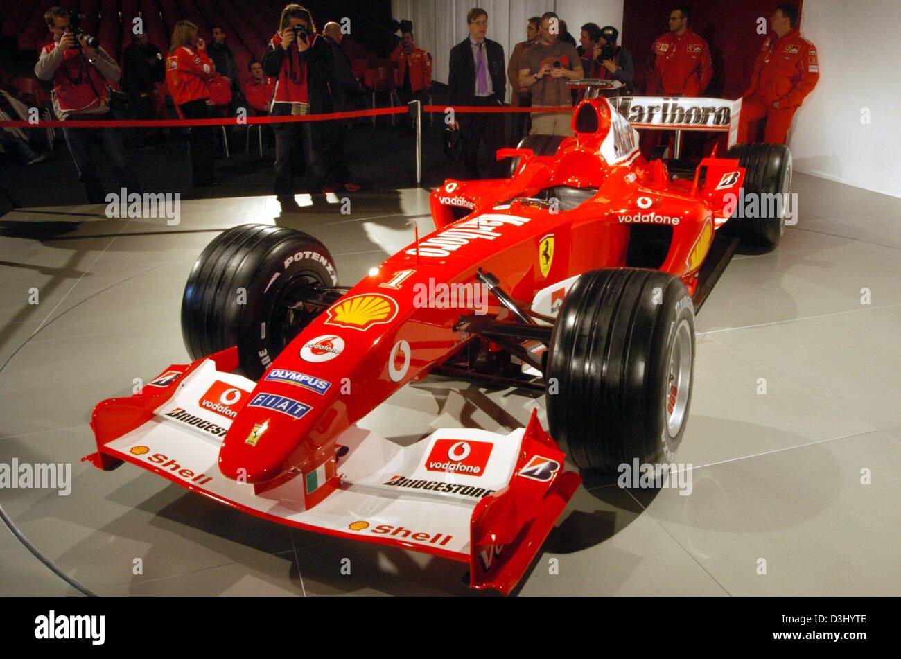 (dpa) - Spectators and photographers examine the F 2004, Ferrari's new ...
