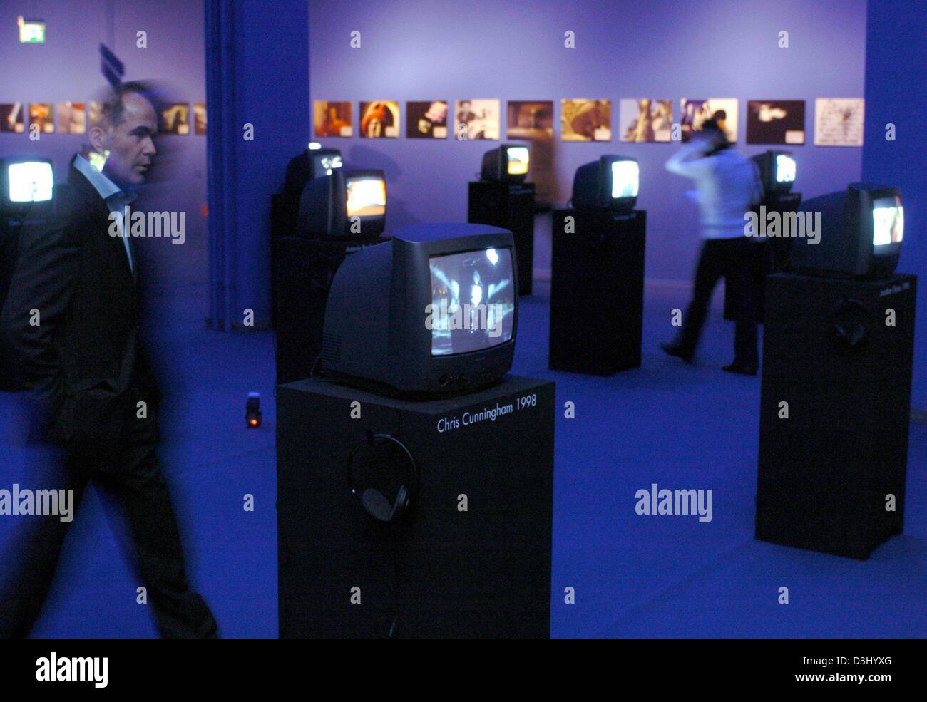 (dpa) - Visitors stroll around a video installation by video artist ...