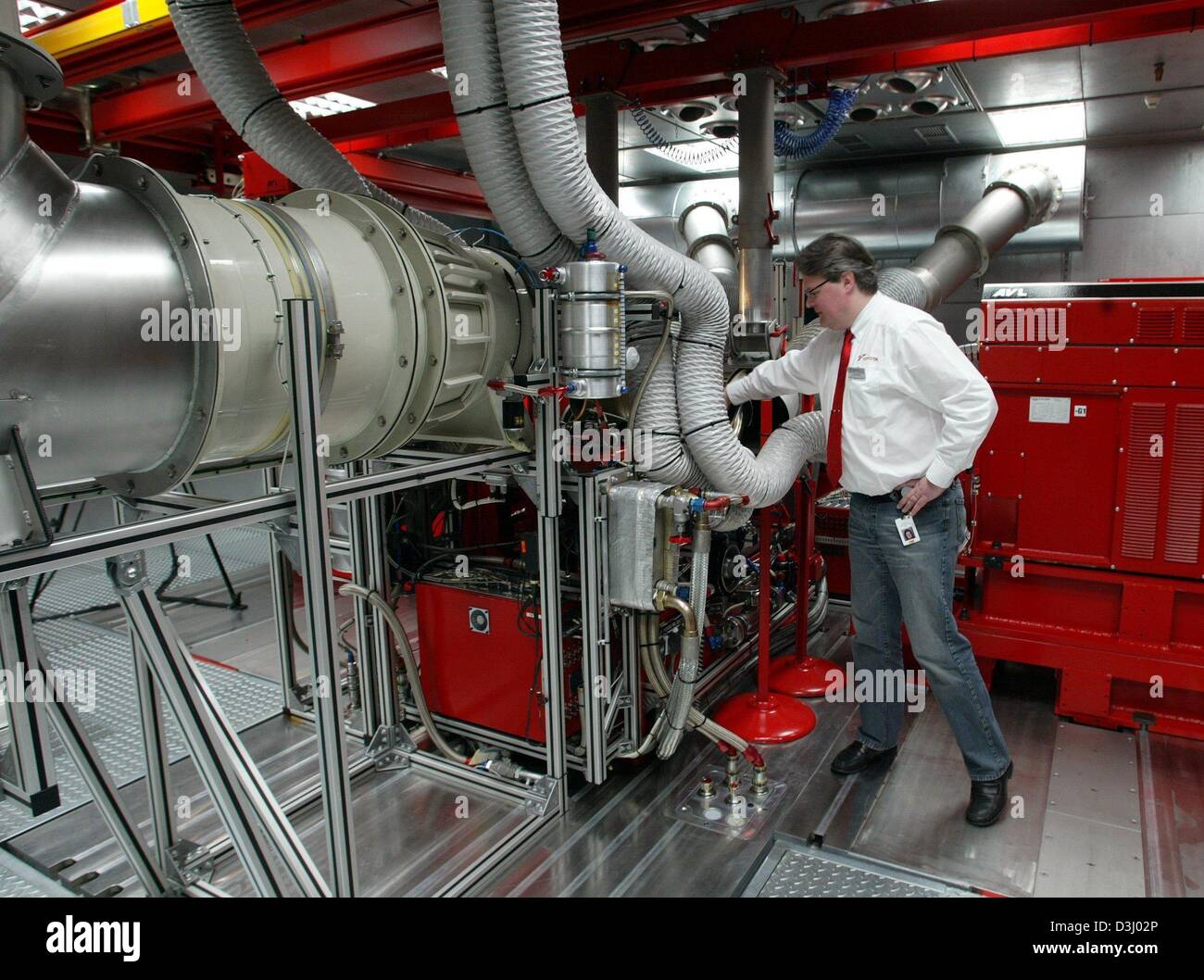 (dpa) - A engineer inspects the test bench for the new Toyota FT 104 ...