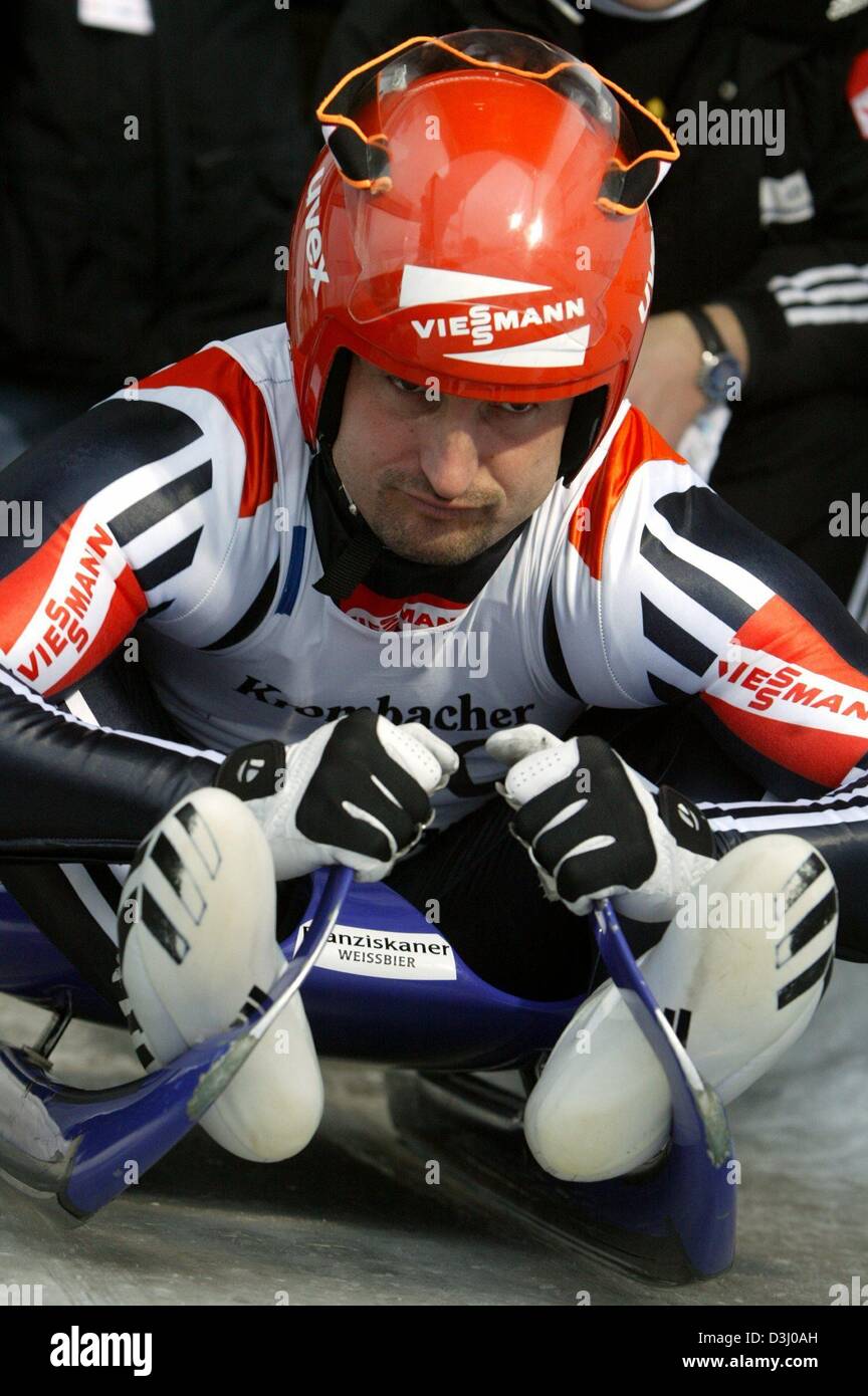 (dpa) - German luger Georg Hackl sits on his sleigh and awaits the ...