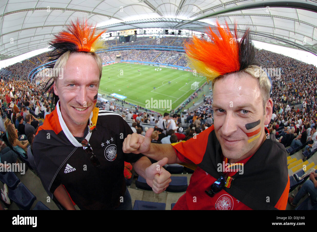 (dpa) - German soccer fans smile prior to the match Germany vs ...