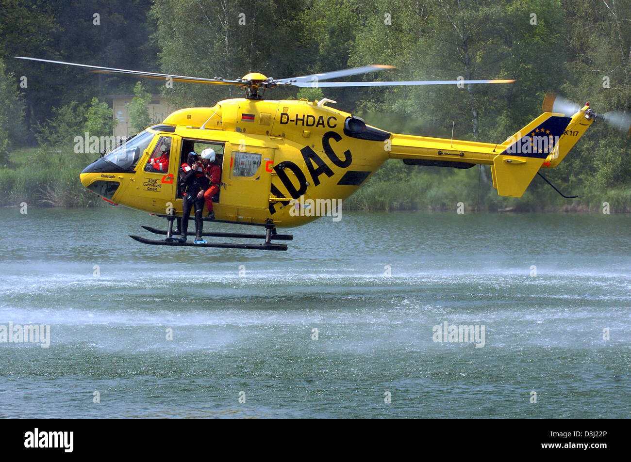 (dpa) - A helicopter hovers with a diver over a quarry pond during a ...