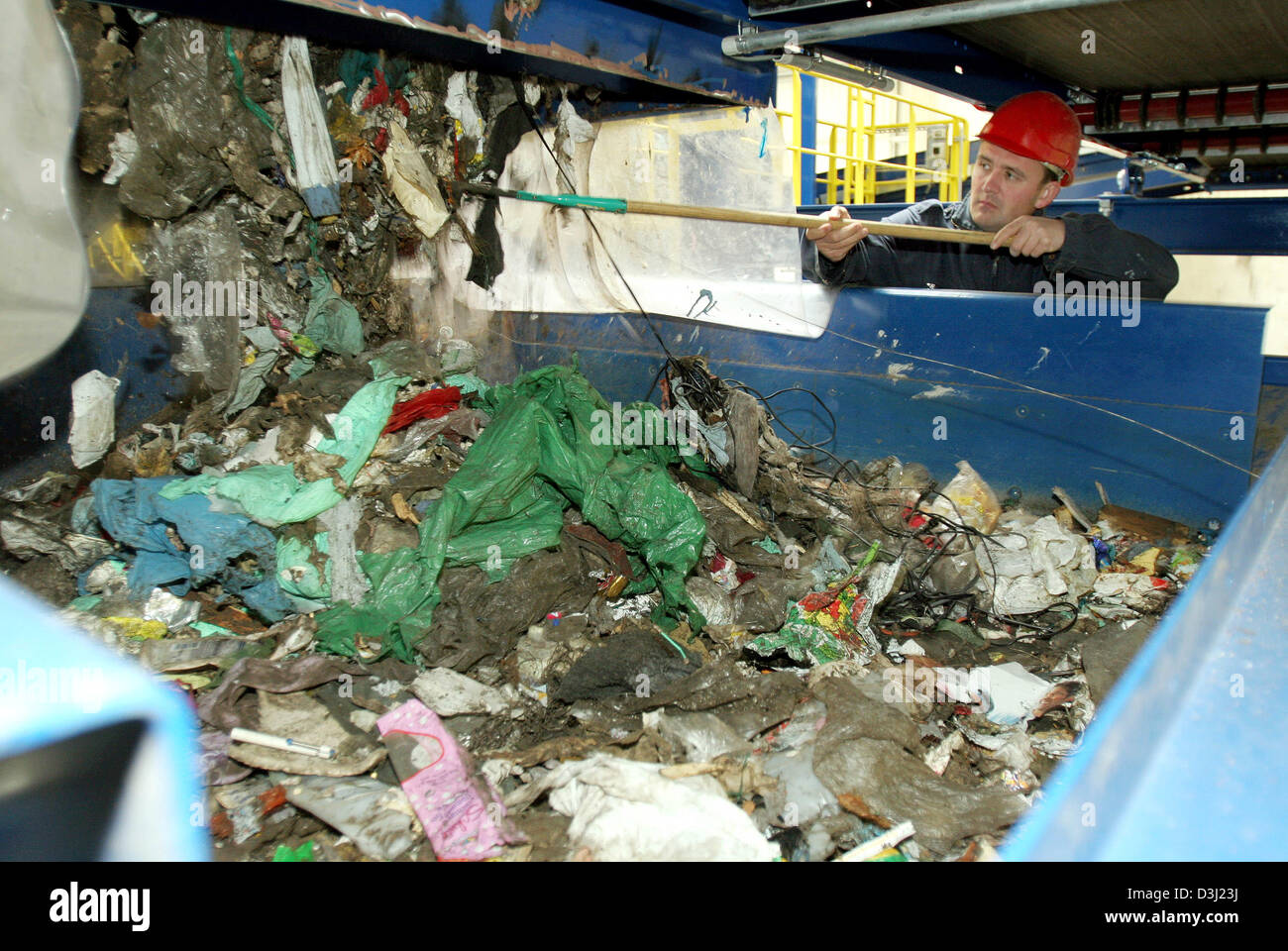 Environmental issues env waste sorting stick helmet rubbish carbage ...