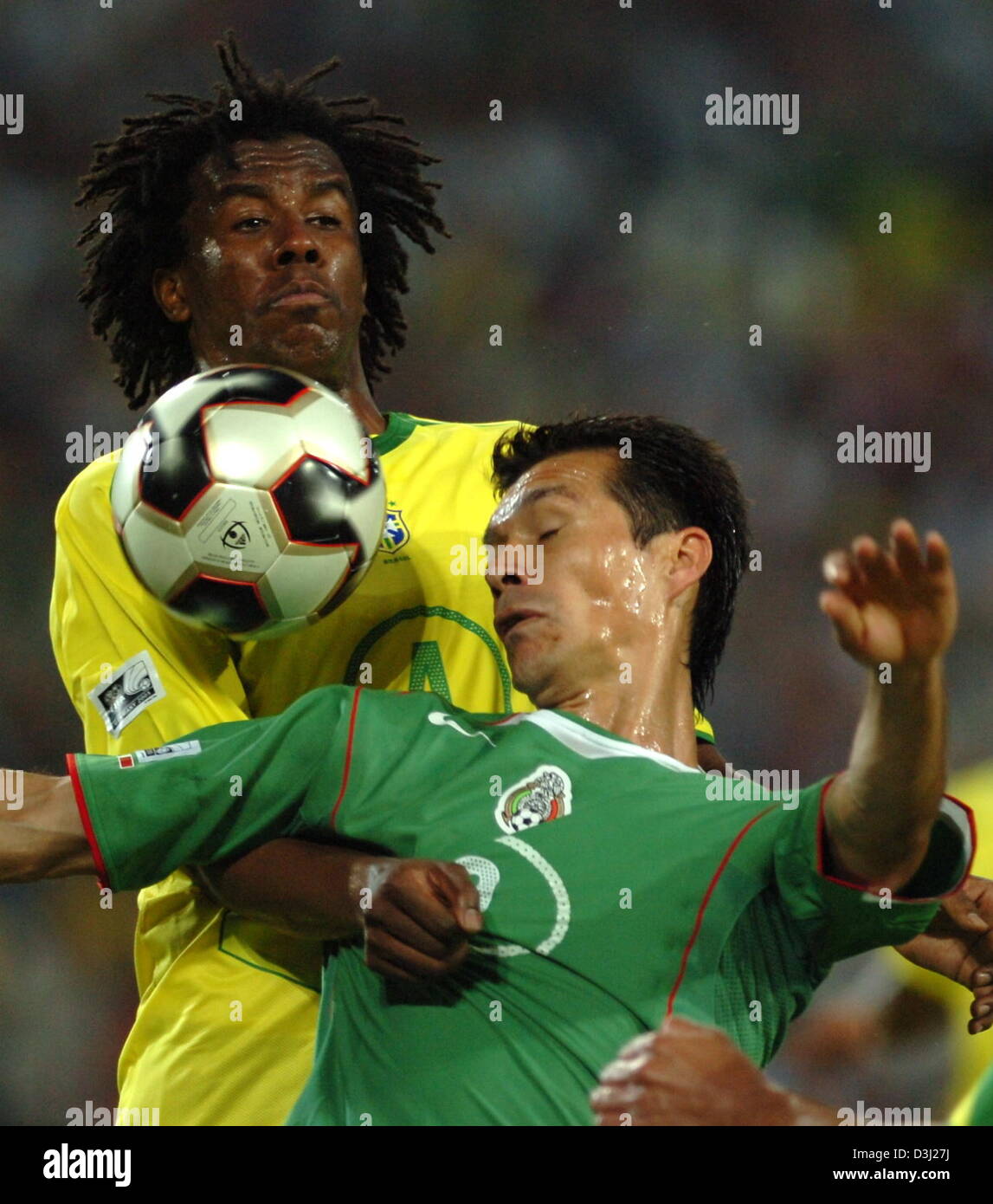 (dpa) - Mexican striker Jared Borgetti (front) fights with Brazilian ...