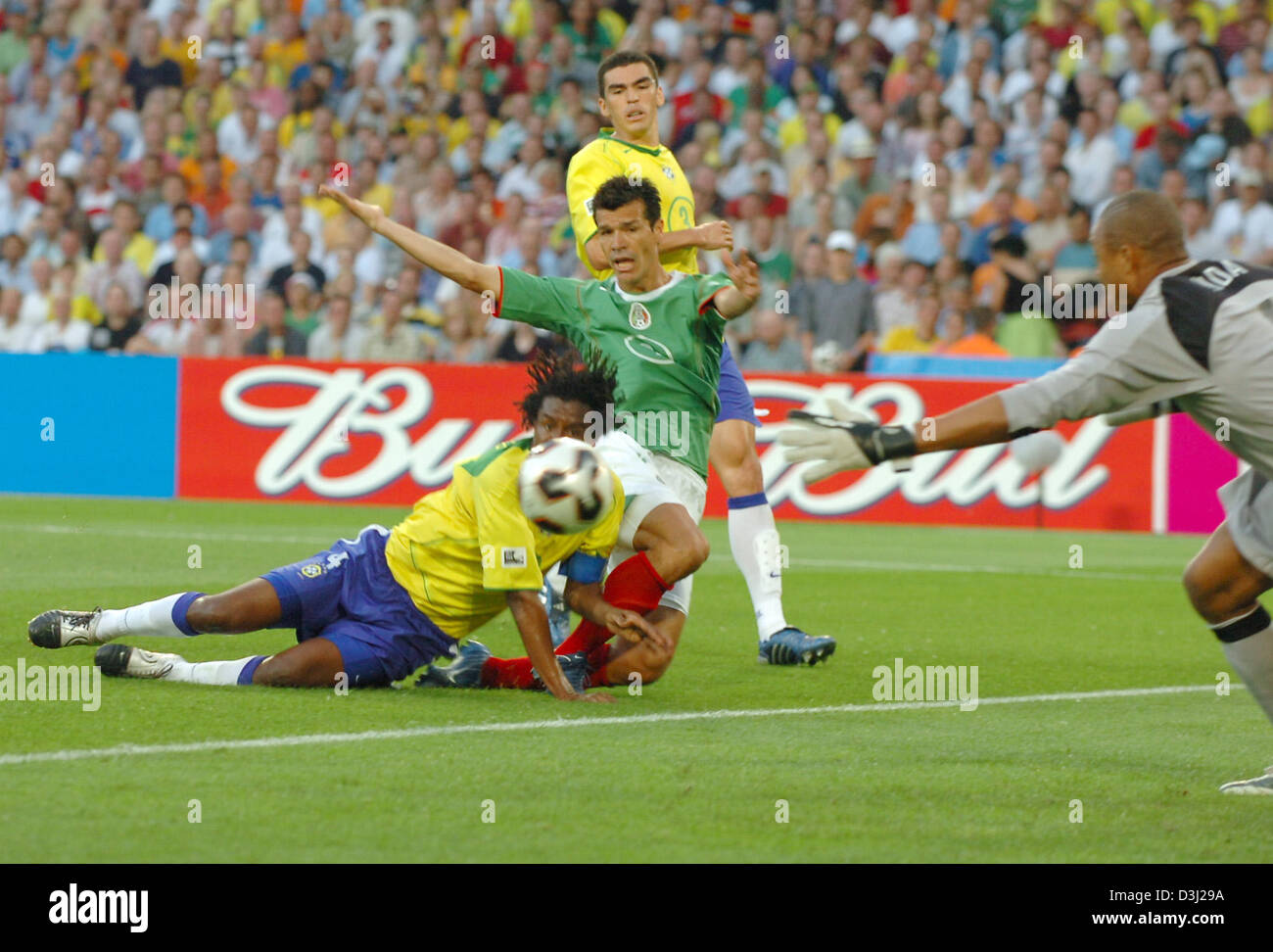 (dpa) - Mexican soccer player Jared Borgetti (C) is fouled by Brazilian ...