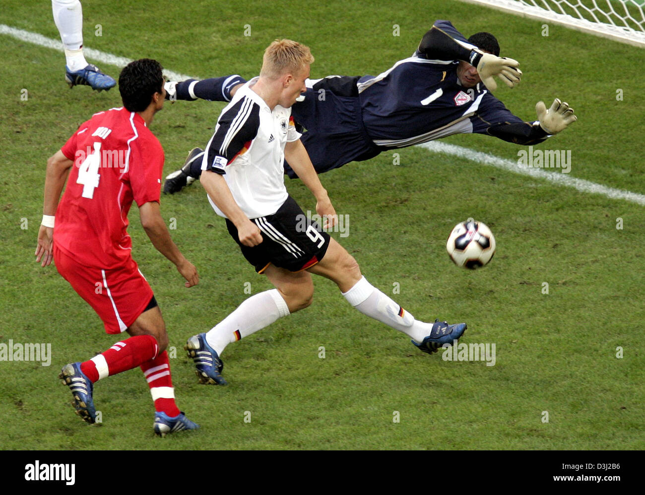 (dpa) - German soccer player Mike Hanke (C) scores the third German ...