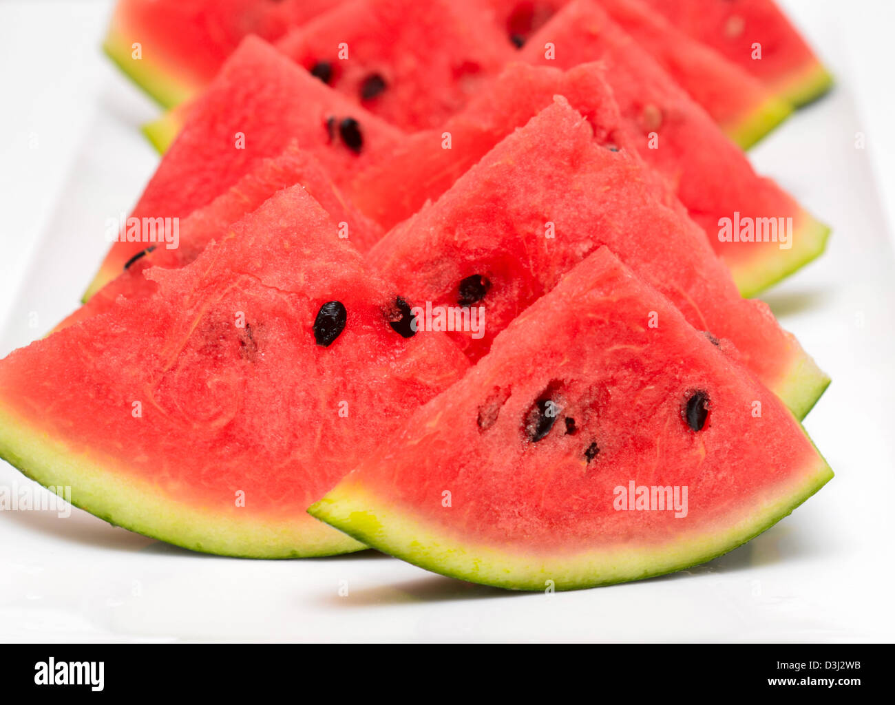Watermelon slices on plate white hi-res stock photography and images ...