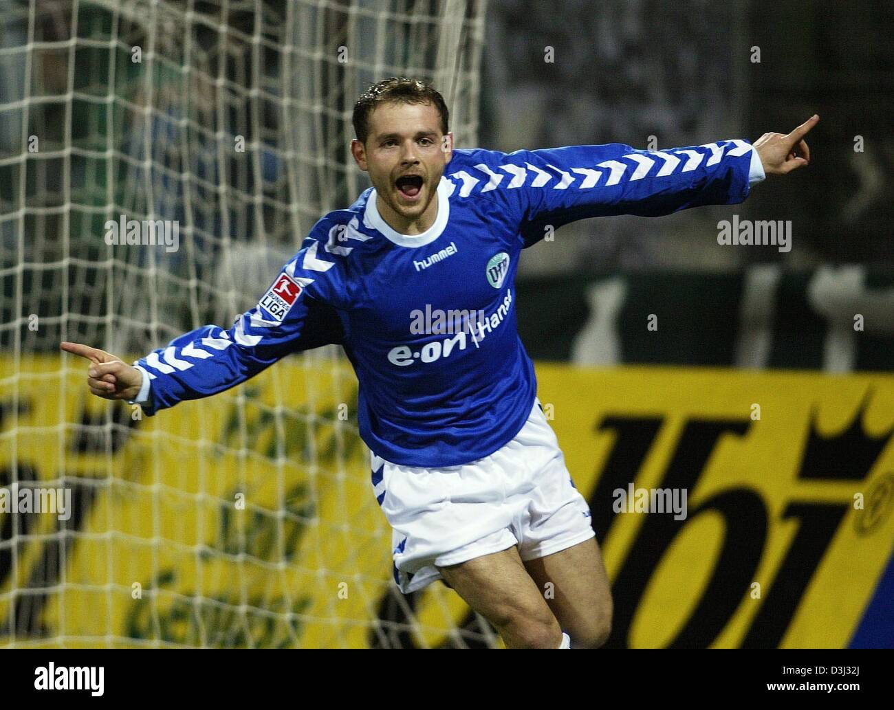 (dpa) - Luebeck's Silvio Adzic spreads his arms and cheers as he turns ...