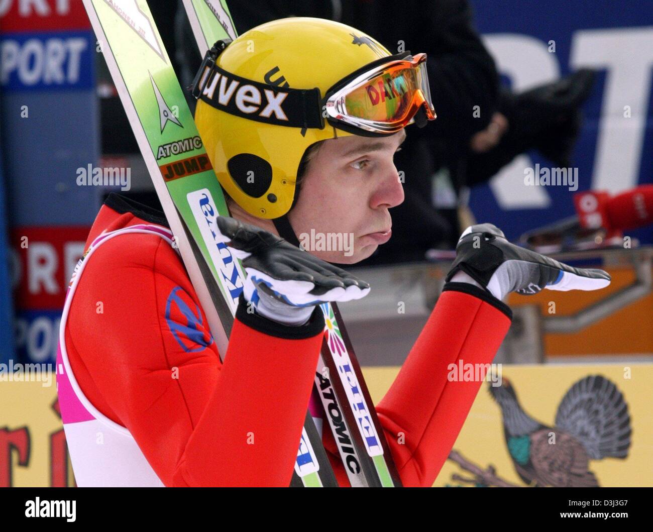 (dpa) - Finnish ski jumper Janne Ahonen gestures after his jump during ...