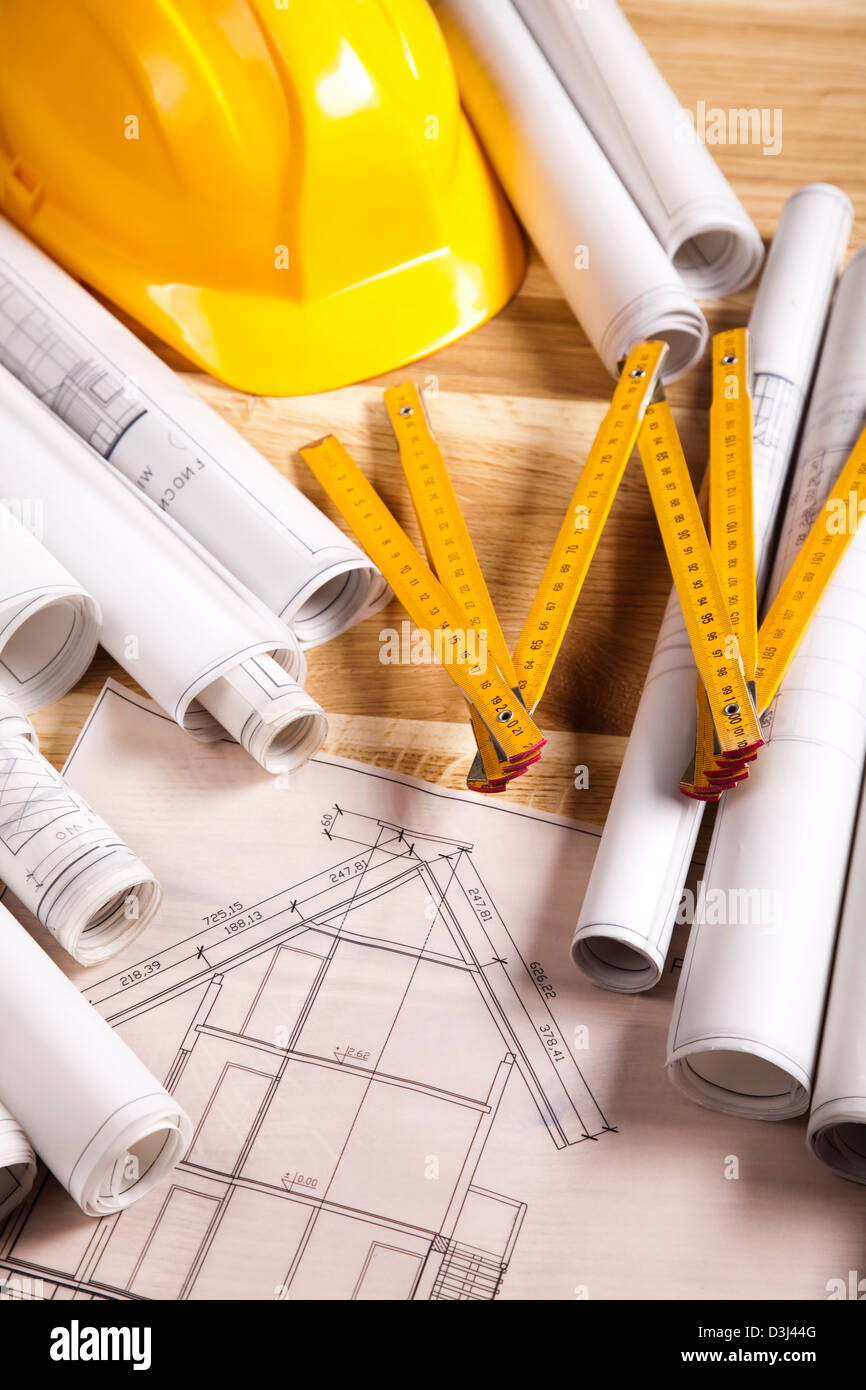 House plan blueprints with yellow hard hat Stock Photo - Alamy