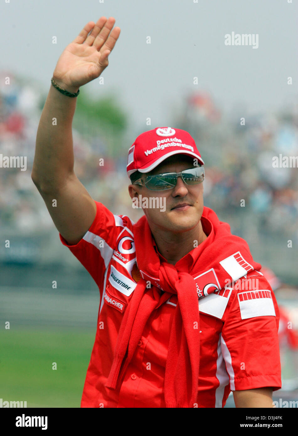 (dpa) - German Formula One driver Michael Schumacher of Ferrari waves ...