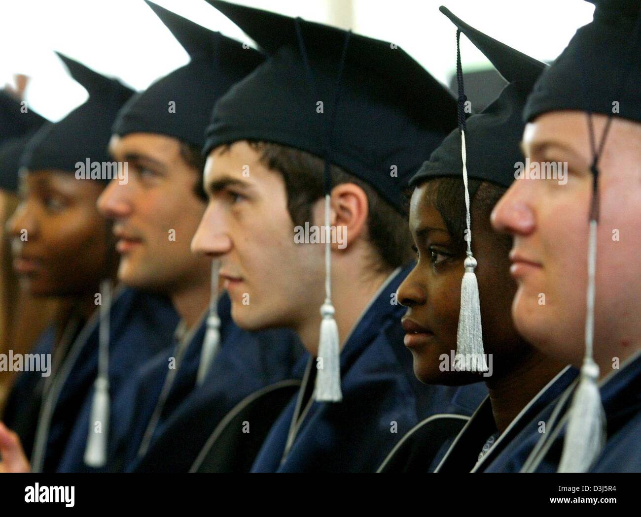 University graduates attend graduation ceremony hi-res stock ...