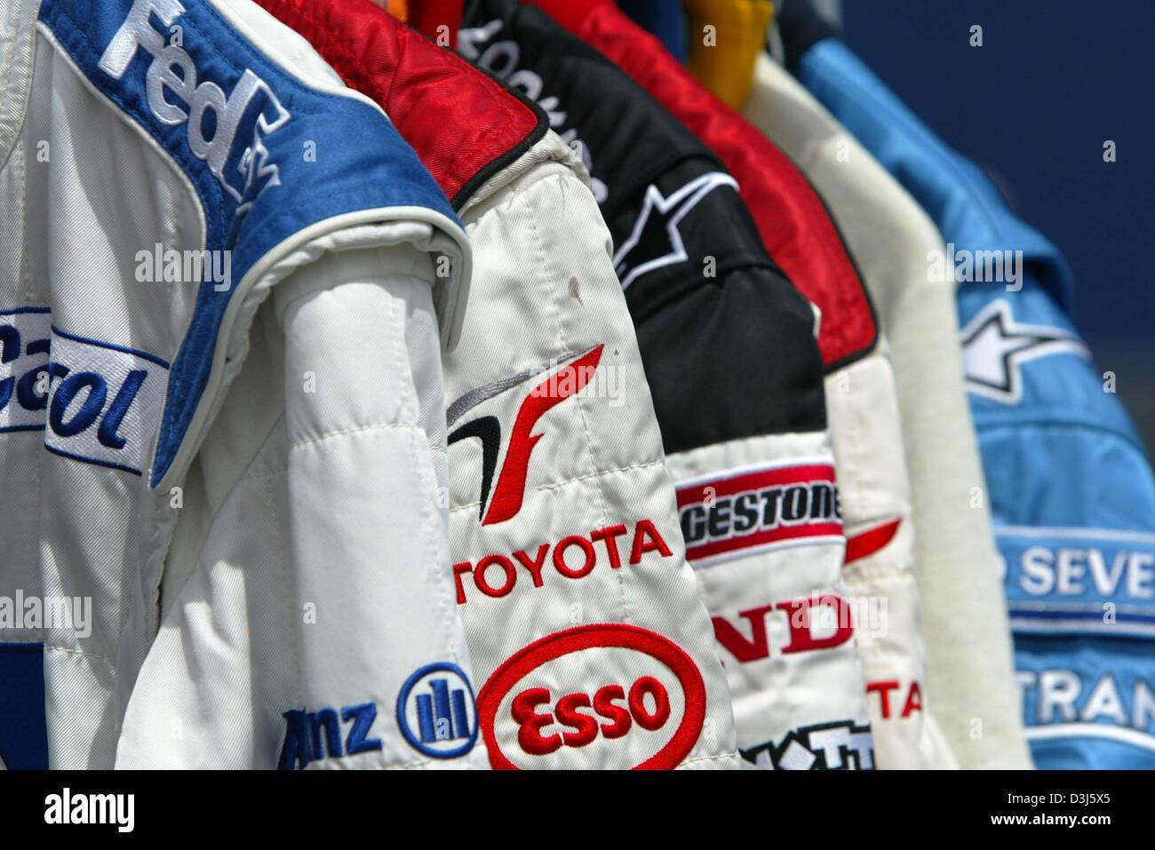 (dpa) - View of several driver's racing overalls taken on the sidelines ...