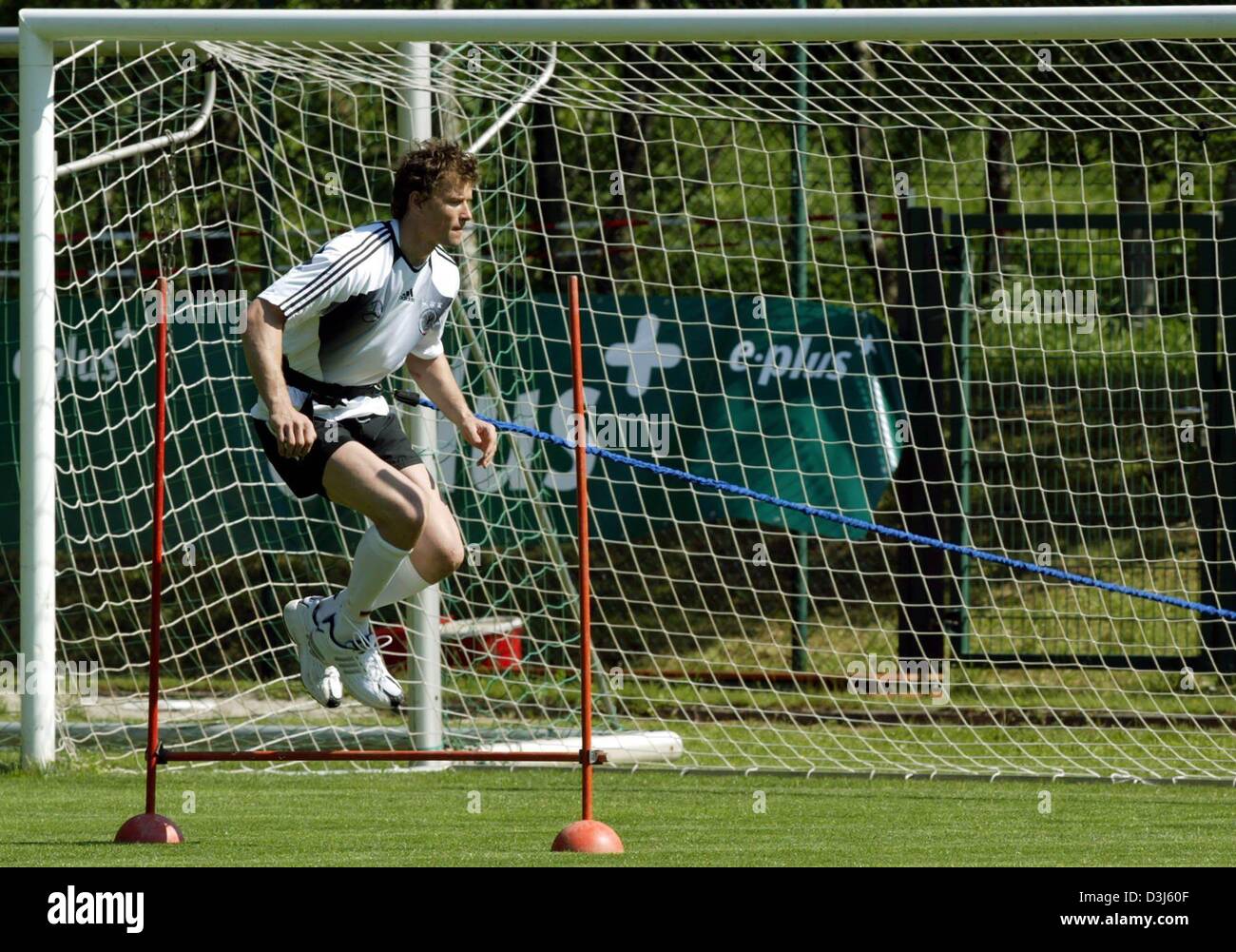 (dpa) - German national team goalkeeper Jens Lehmann works on his ...