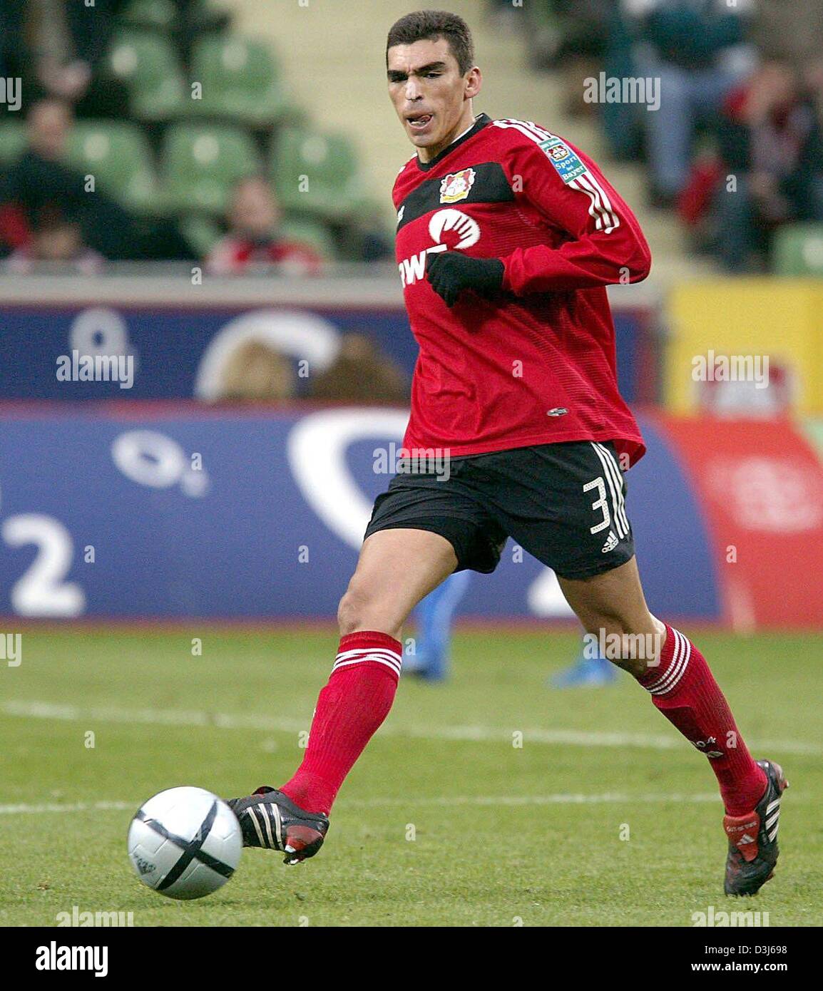 (dpa files) - Brazilian national team defender Lucio advances the ball ...