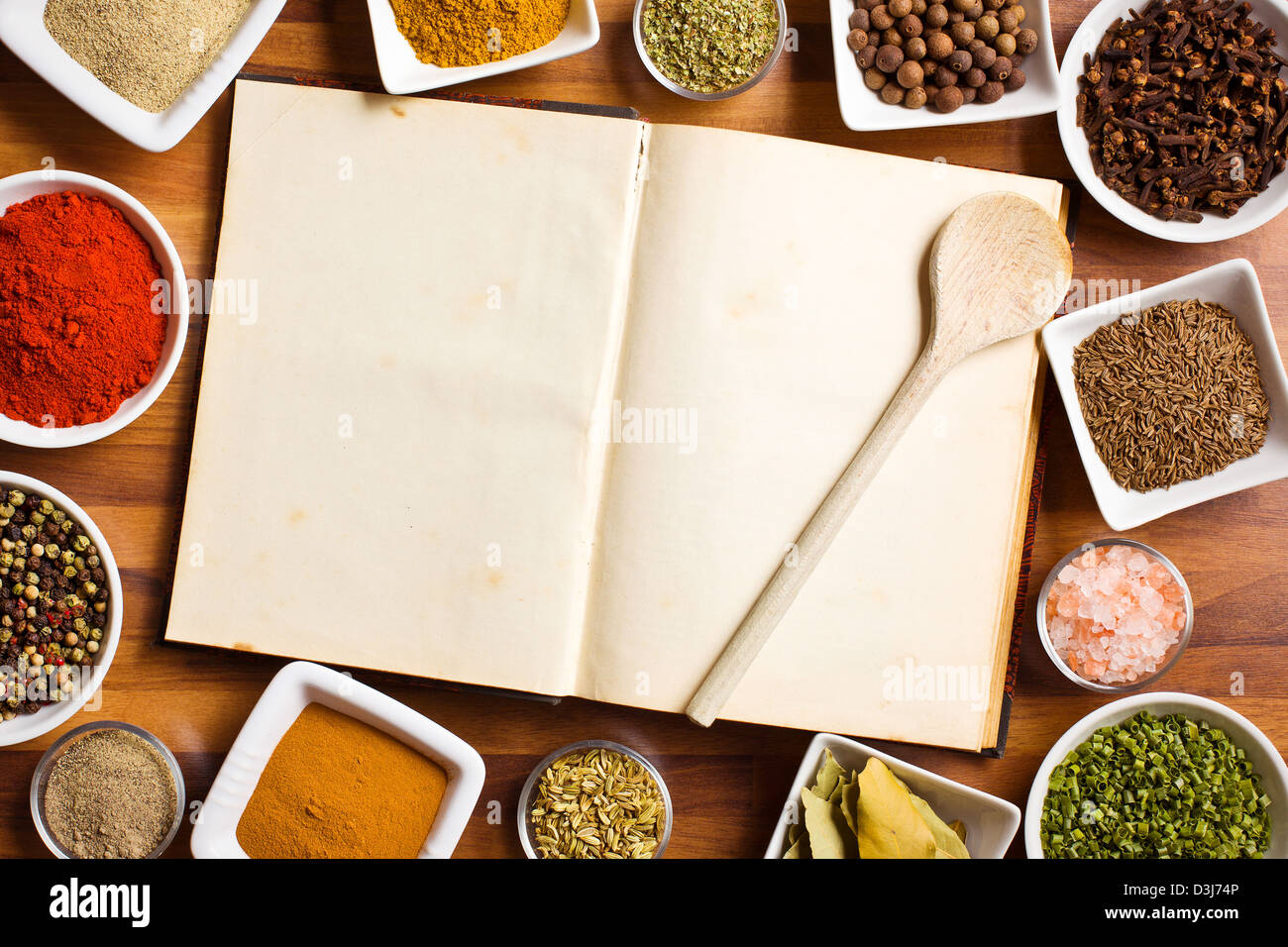 The cookbook and various spices and herbs Stock Photo - Alamy