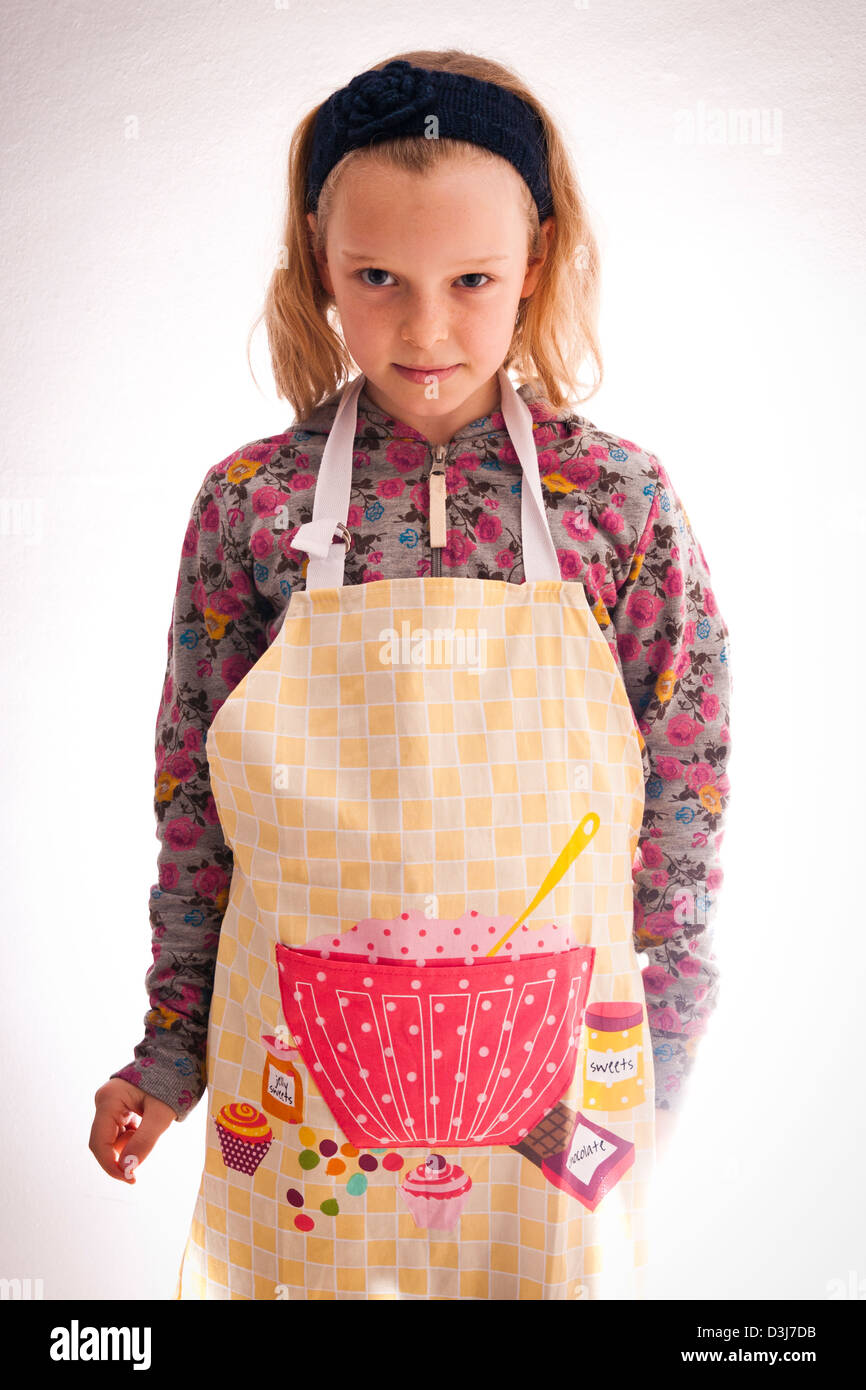 Girl wearing cooking apron Stock Photo - Alamy