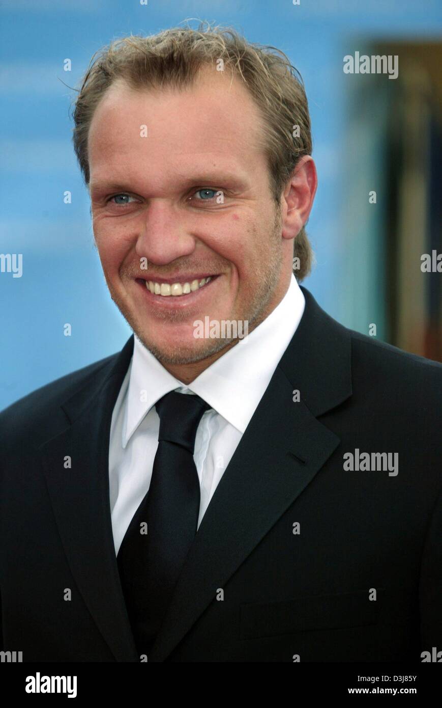 (dpa) - Austrian skier Hermann Maier smiles as he poses with the ...
