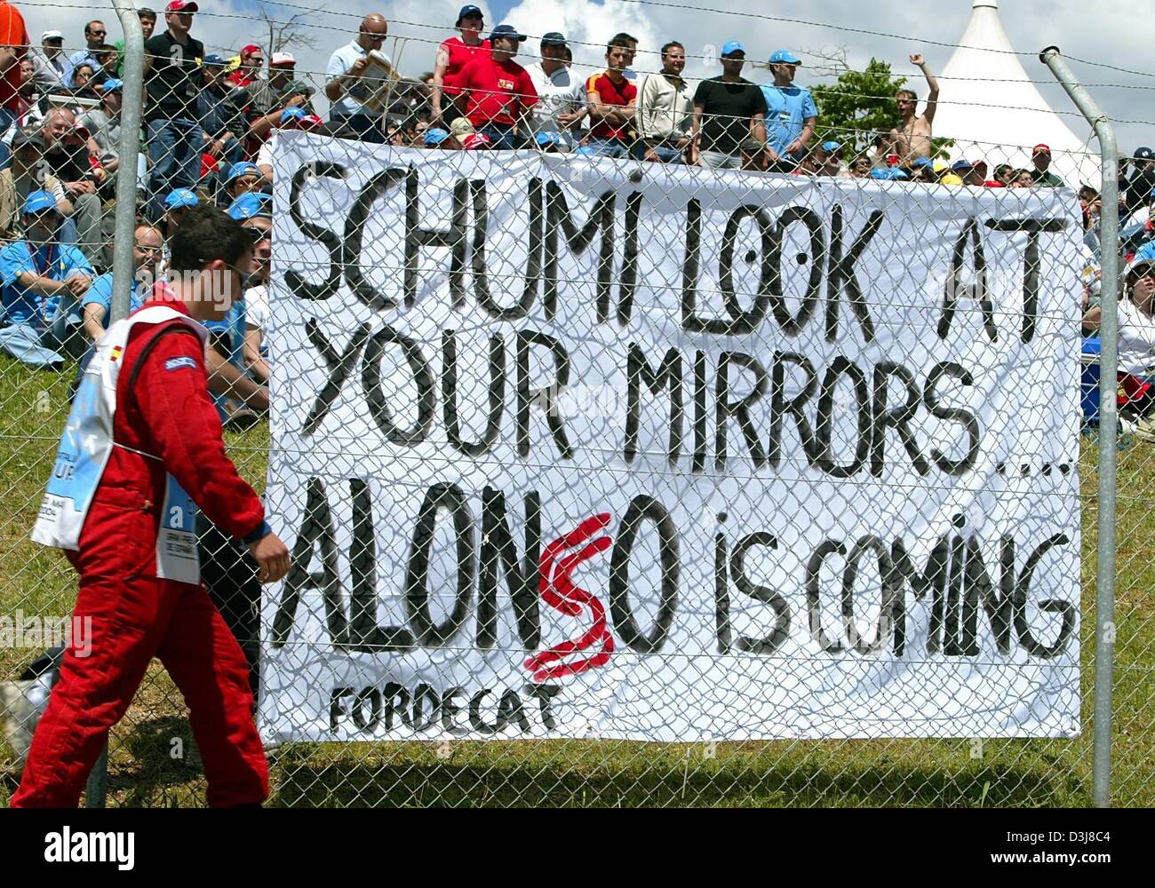 (dpa) - Spanish formula one fans mount a banner reading 'Schumi look at ...