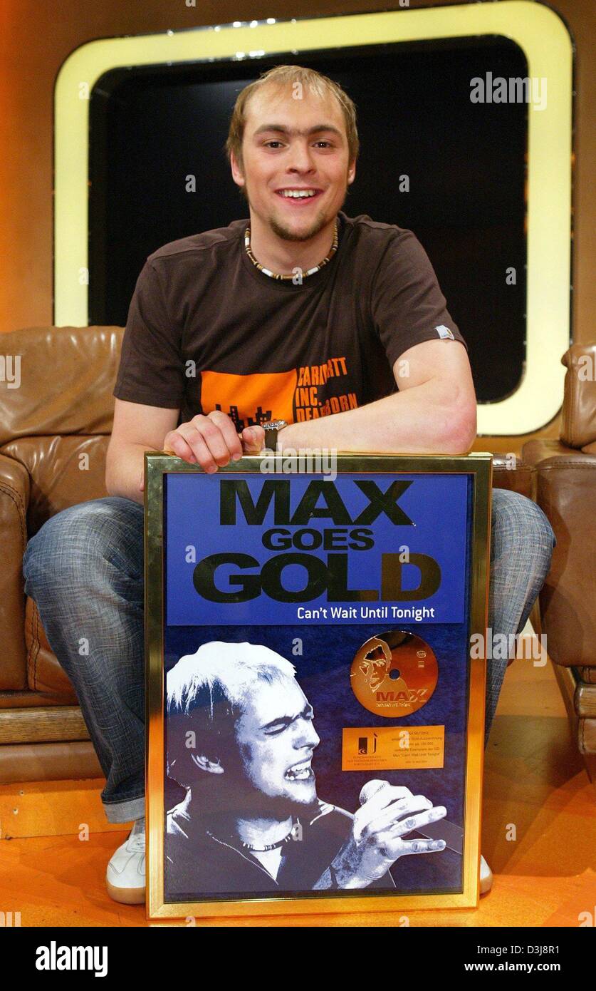 (dpa) - German singer Max poses with his gold album which he received ...
