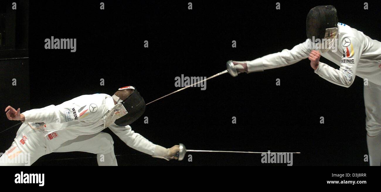 (dpa) - Two epee fencers in a fight during the German Fencing ...