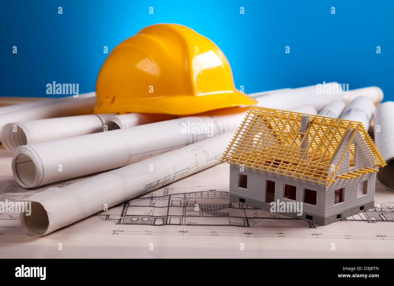 Architectural plans of house and hard hat Stock Photo - Alamy